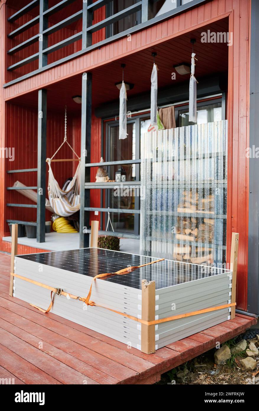 Solar panels prepared for installation, lying on the terrace of modern ...