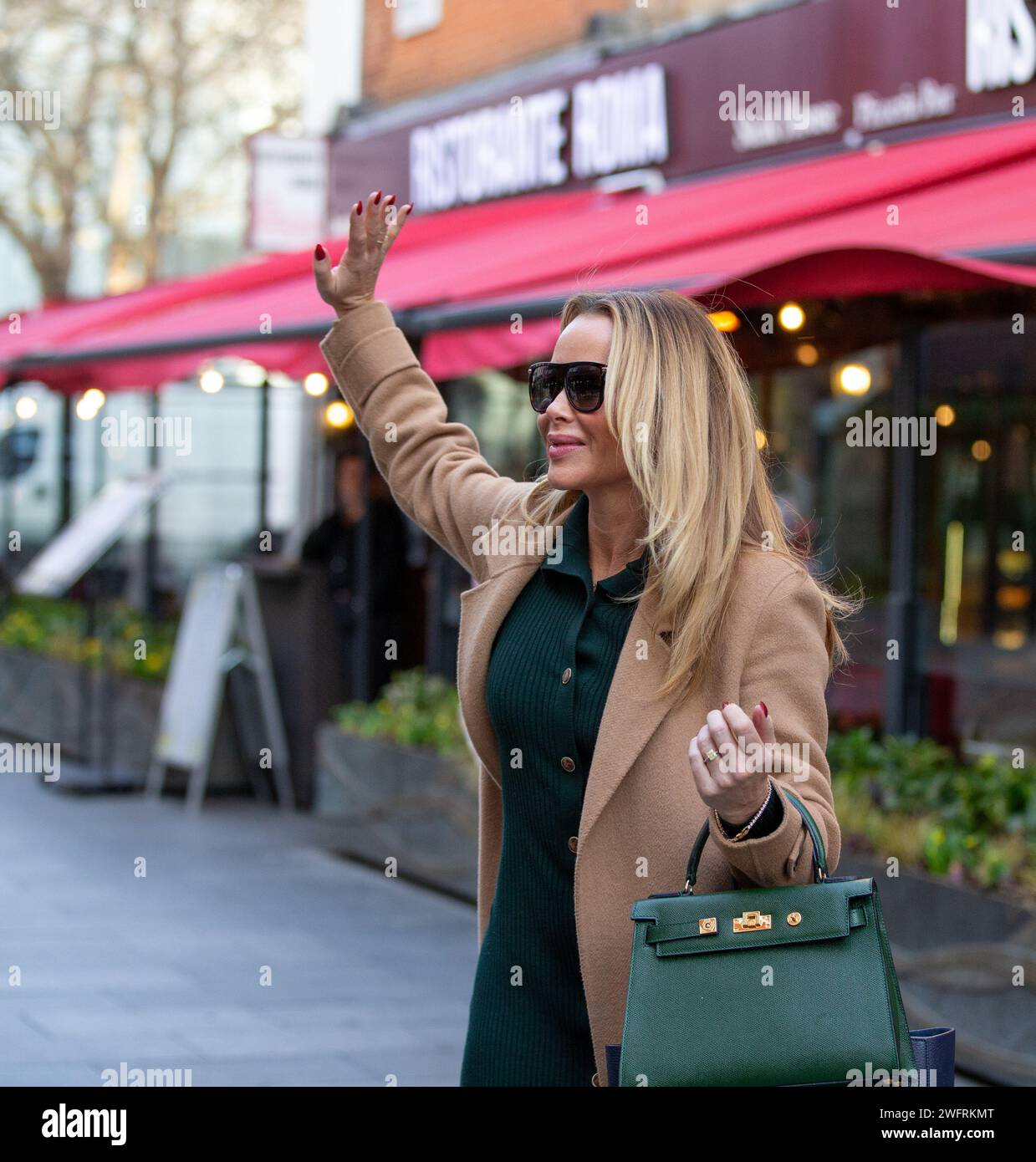 London, UK. 1st Feb, 2024. Amanda Holden waves to member of the public ...