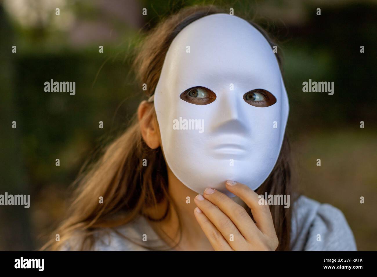 woman with full face white mask looking at sideways Stock Photo - Alamy