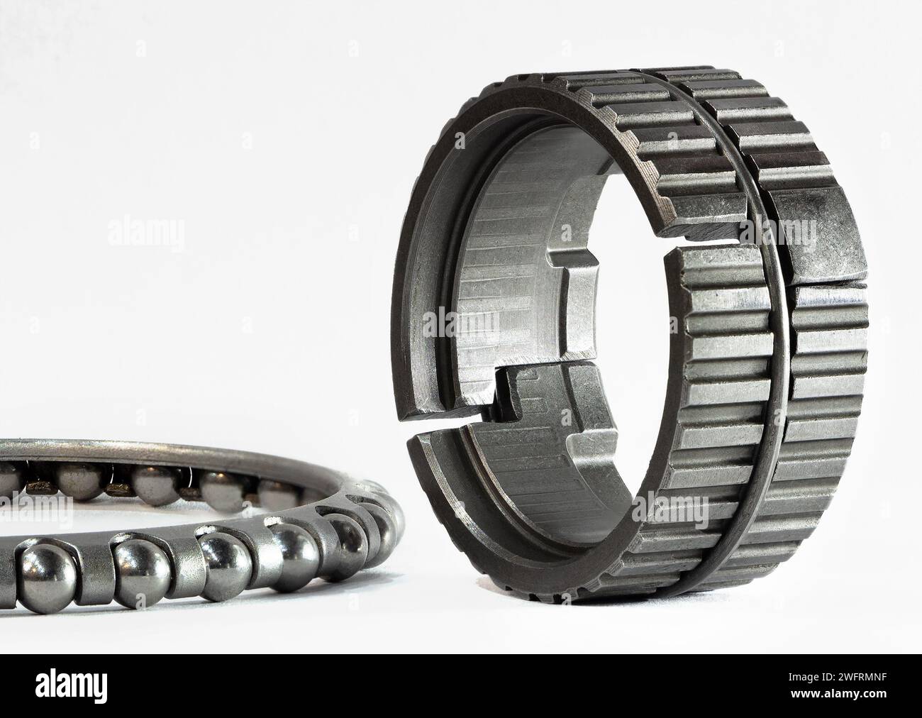 Metal parts of the mechanism. Gear and bearing on a white background ...