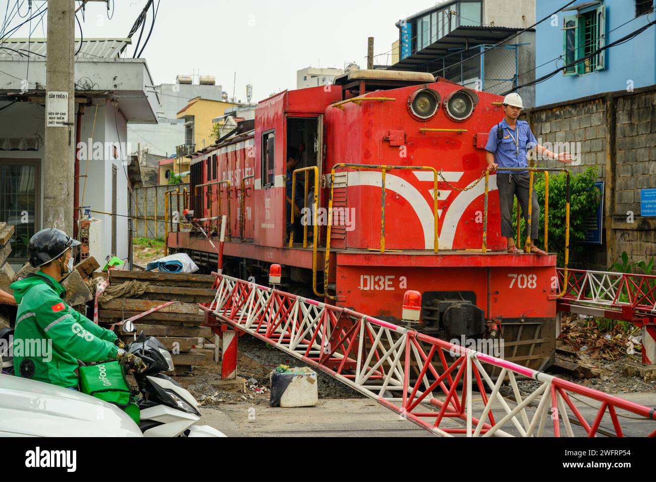 A Vietnamese shunting train crossing a Level Crossing in Ho Chi Minh ...