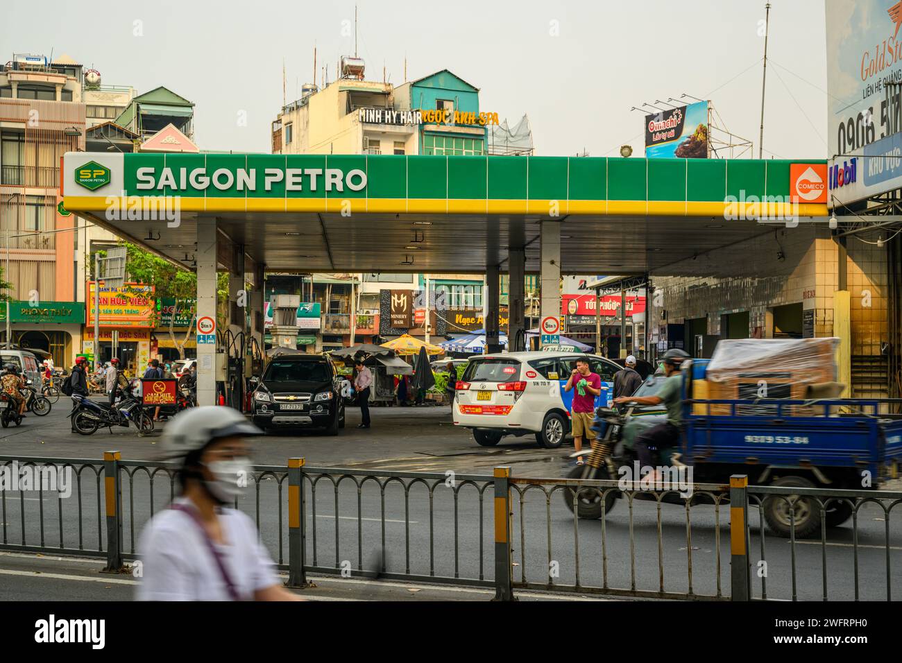 Saigon Petro fuel station with passing traffic, Ho Chi Minh City ...