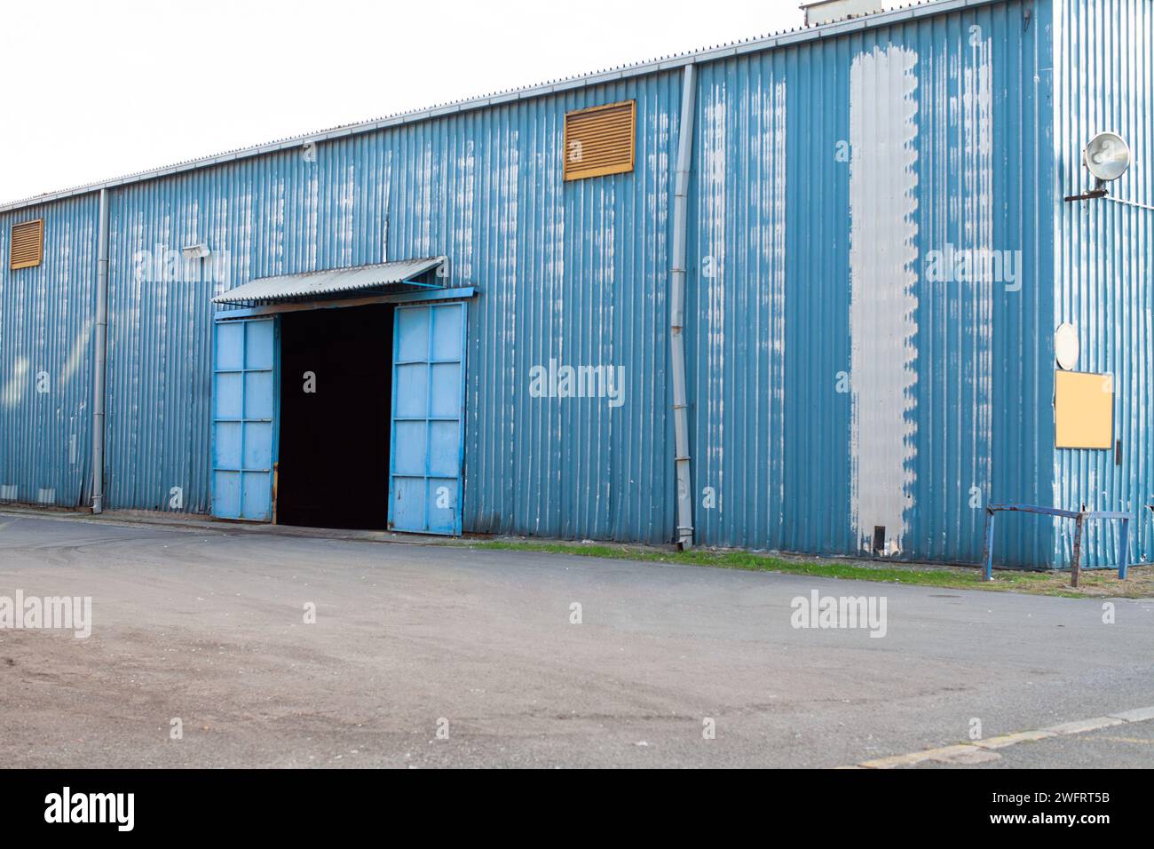 warehouse hangar with corrugated metal walls Stock Photo - Alamy