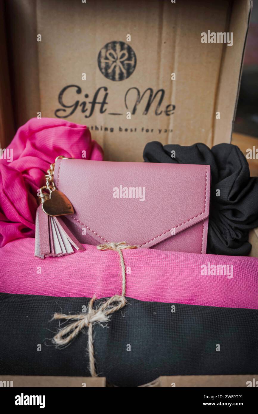 Stock photo of gift box wrapped in craft paper with gold ribbon with ...