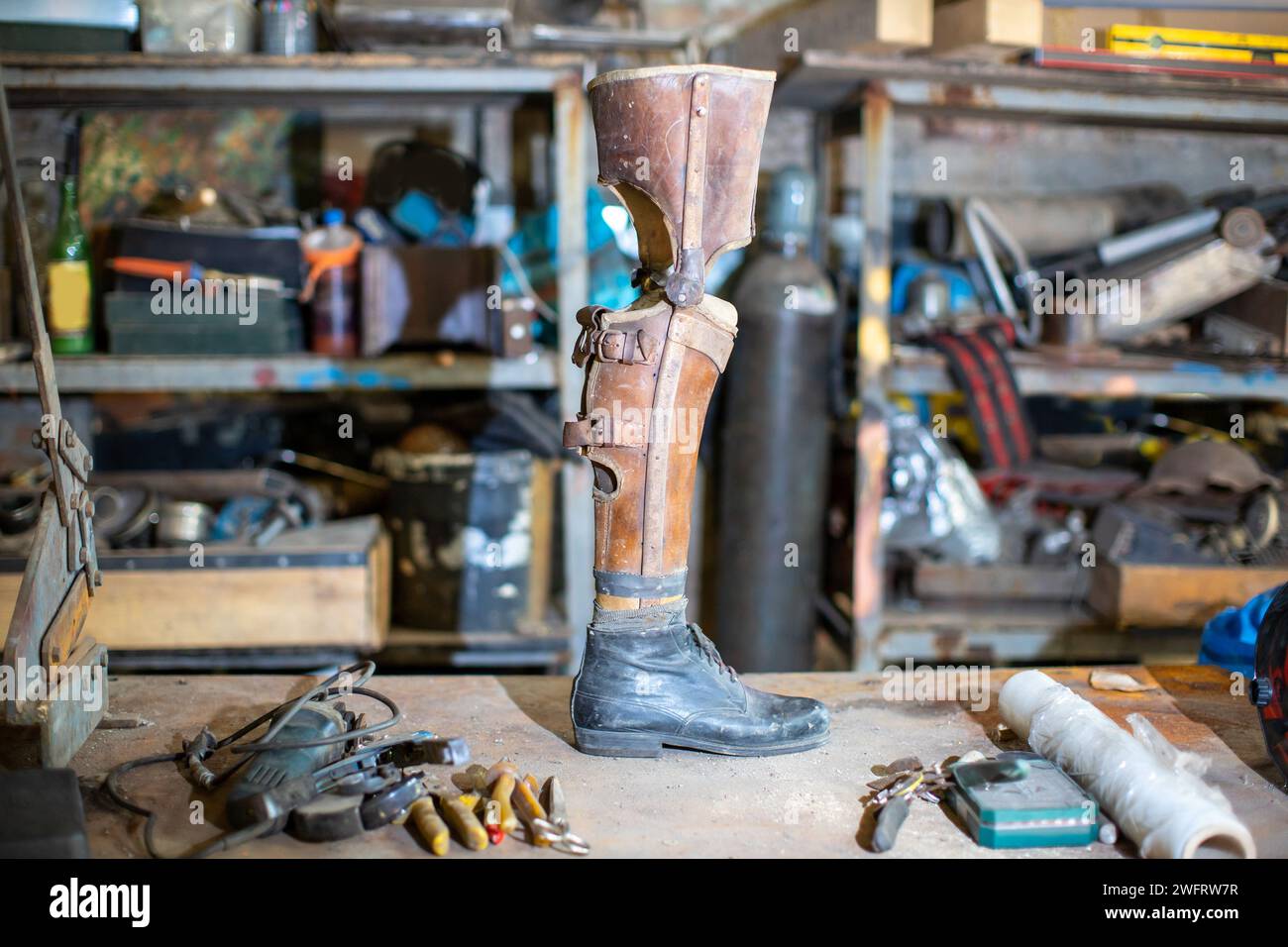 old prosthetic leg displayed on workshop table Stock Photo - Alamy