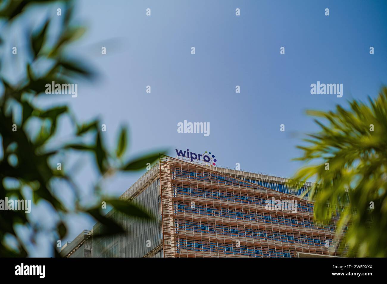 Wipro logo is shown at the top of their building. Wipro Ltd. is a ...