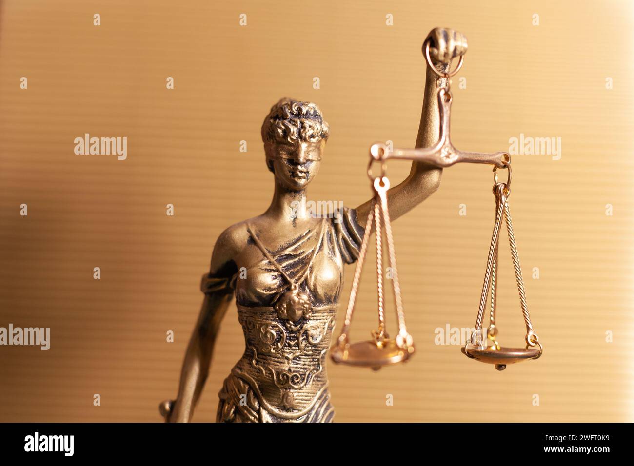 lady justice on golden background Stock Photo - Alamy