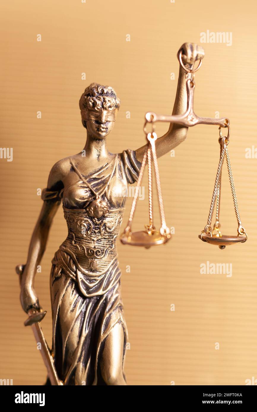 lady justice on golden background Stock Photo - Alamy