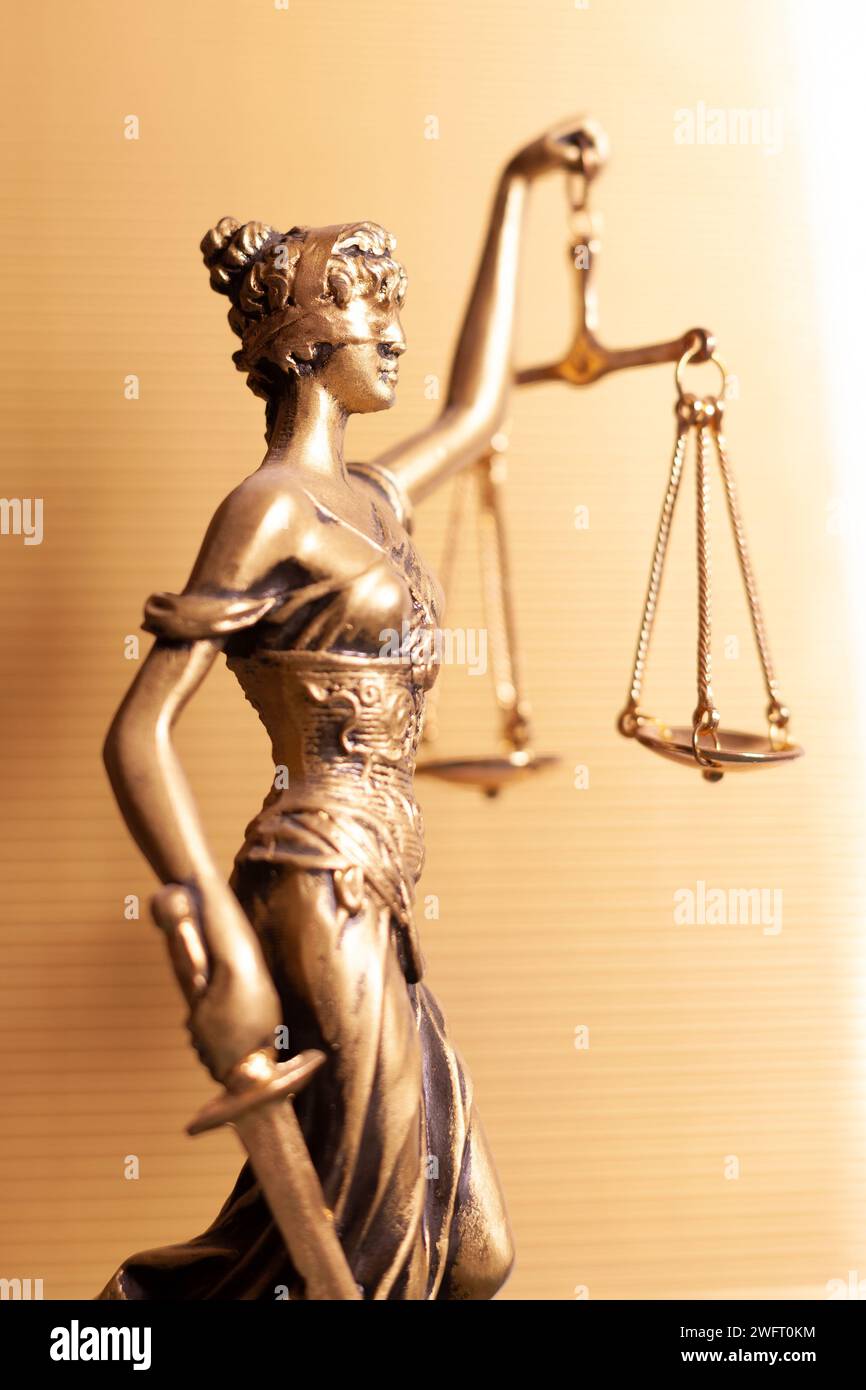 lady justice on gold background Stock Photo - Alamy