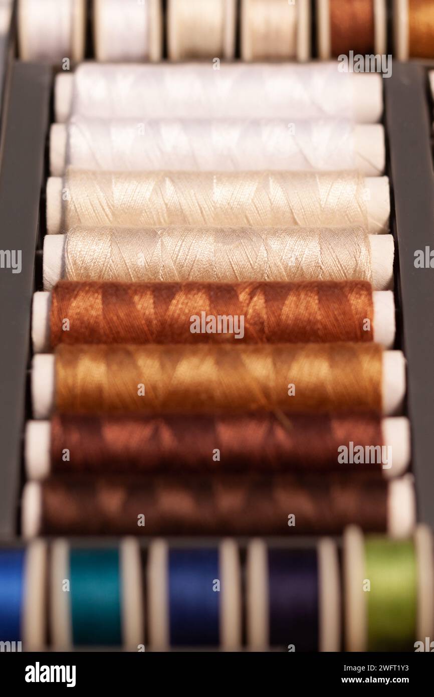 colorful sewing threads on spools Stock Photo - Alamy