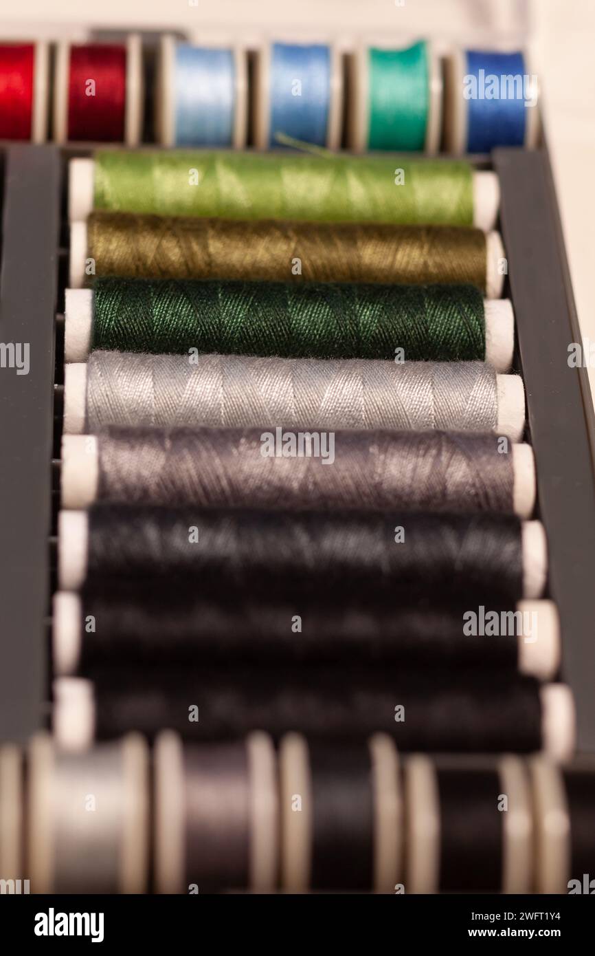 colorful sewing threads on spools Stock Photo - Alamy