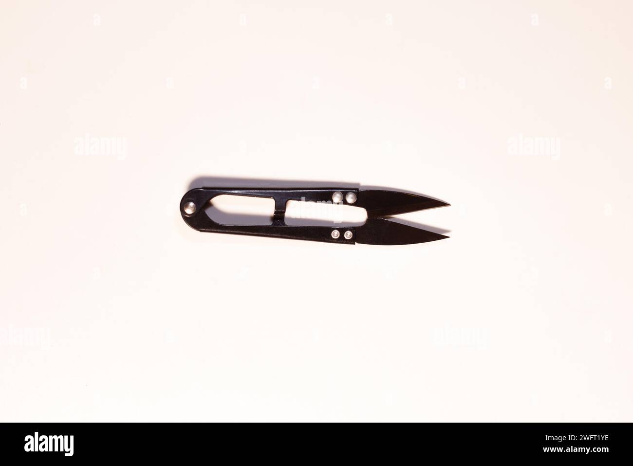 tailoring thread trimmer isolated on white background Stock Photo - Alamy