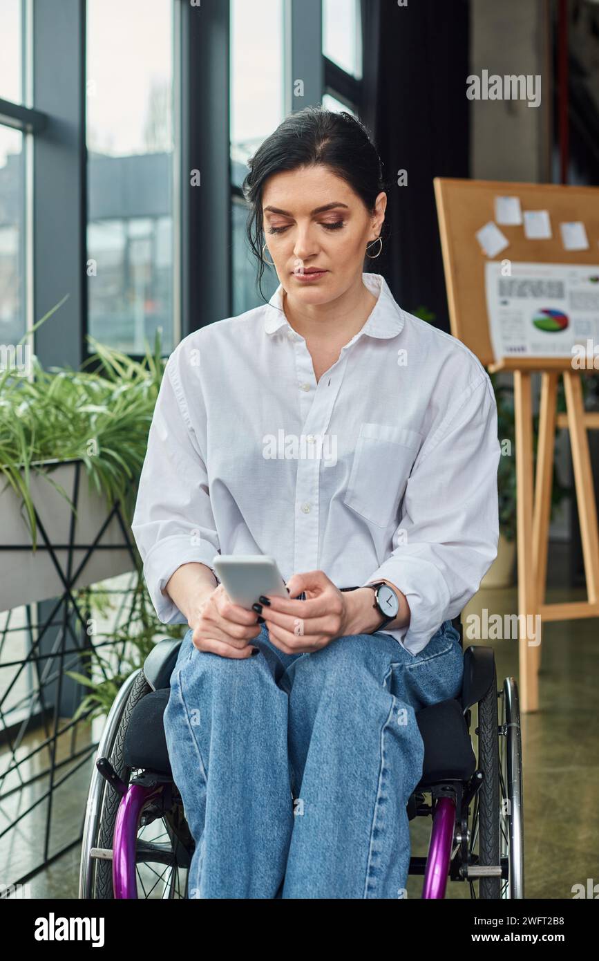 good looking hard working woman with disability in wheelchair looking ...