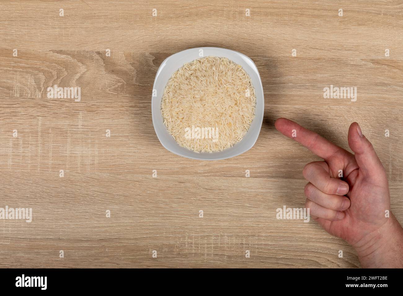 Hand Pointing at Delicious White Rice Bowl, Hunger, Food and ...