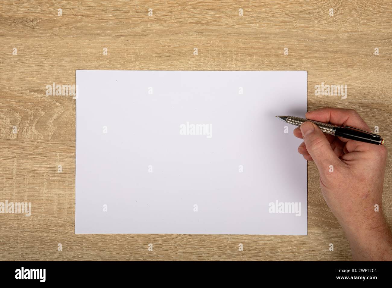 Creative Workspace: Top-Down View of Hand Drawing with Pen on ...