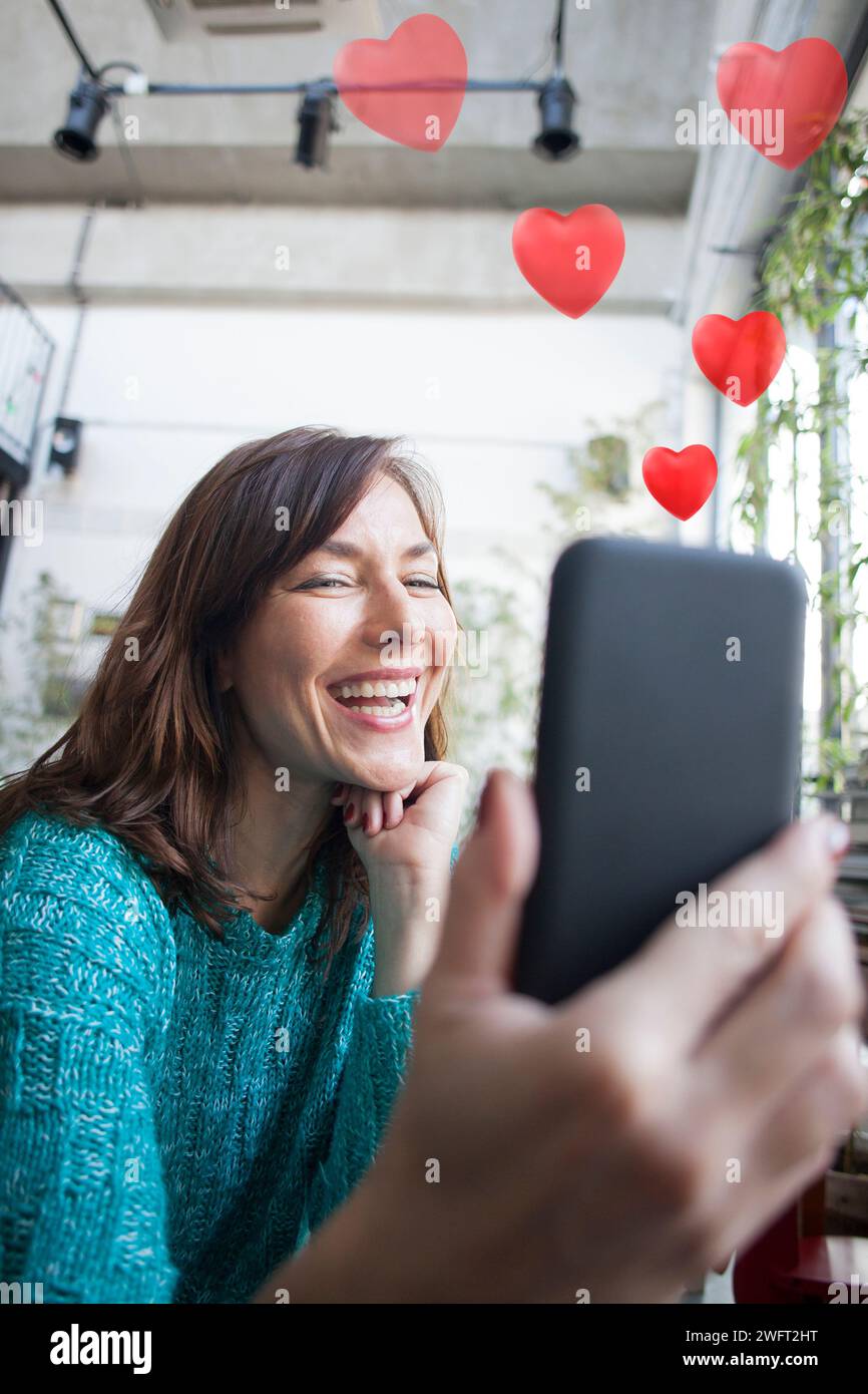 Woman kissing phone screen hi-res stock photography and images - Alamy