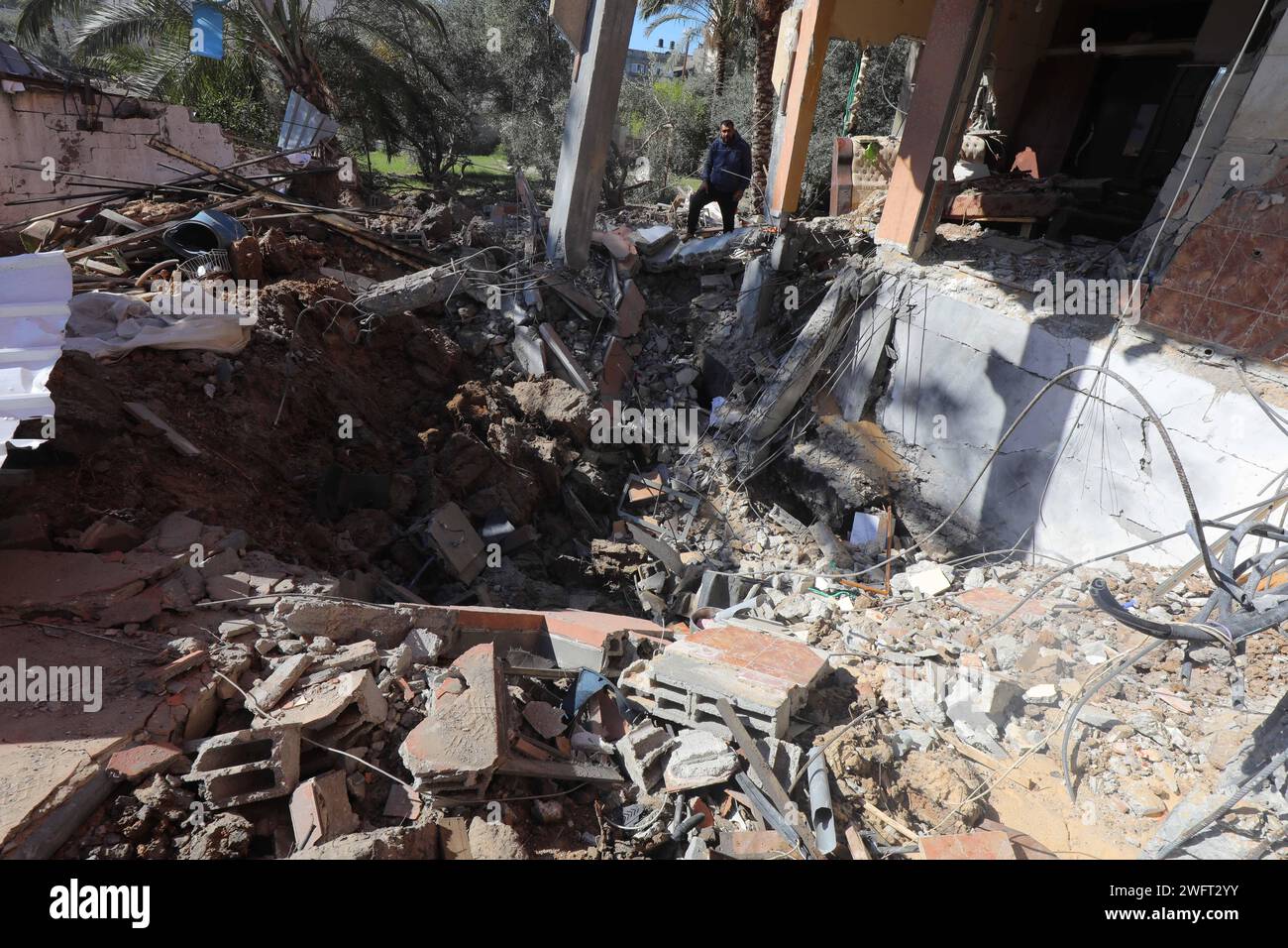 Palestinians inspect the rubbles of demolished buildings after Israeli ...