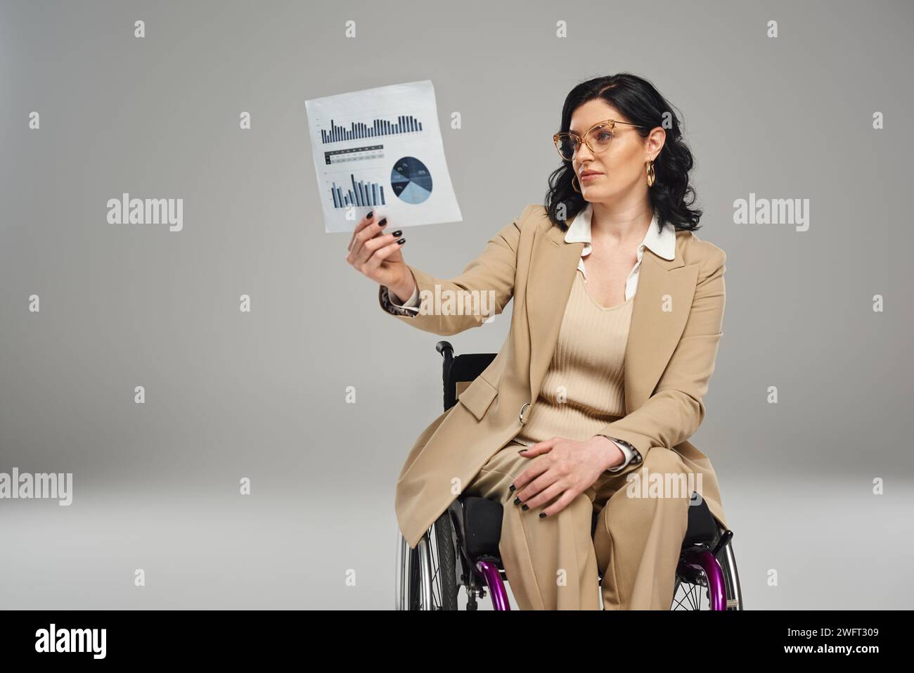 pensive beautiful woman with mobility disability in glasses looking at ...