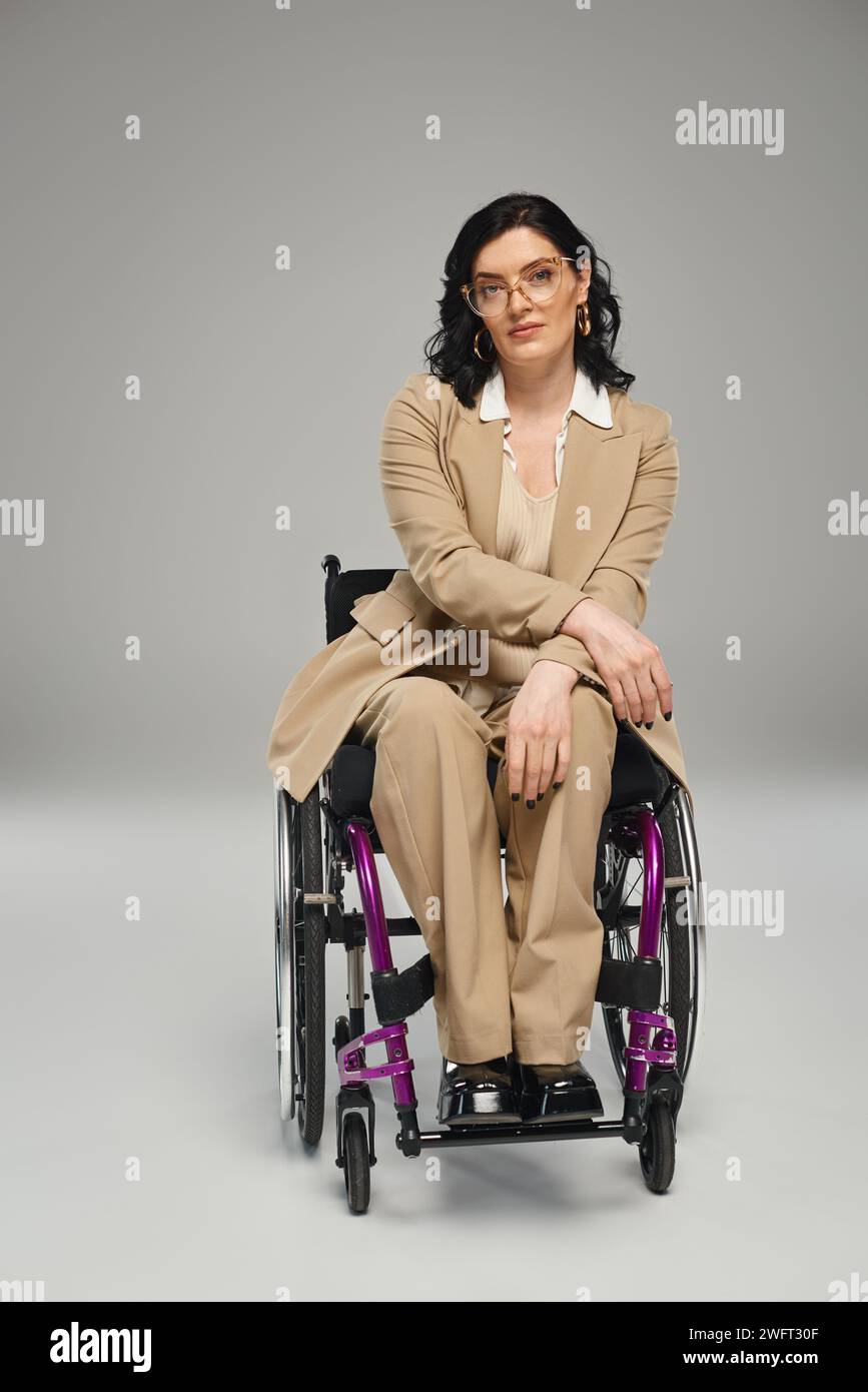 beautiful disabled woman with wavy hair in pastel suit with glasses in ...