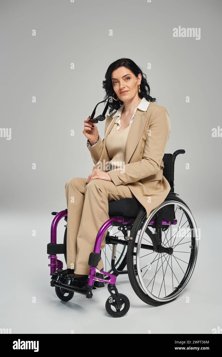 beautiful confident woman with disability in wheelchair looking at ...