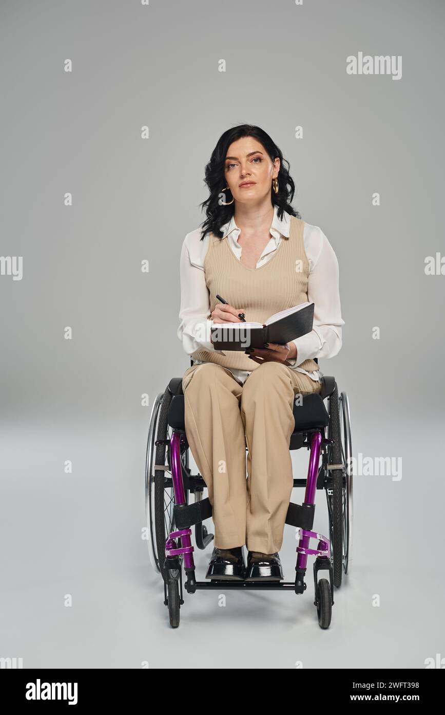 attractive confident woman with disability sitting in wheelchair with ...