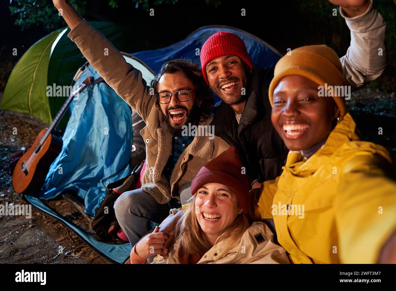 Happy friends camping and having a barbecue in nature Stock Photo - Alamy