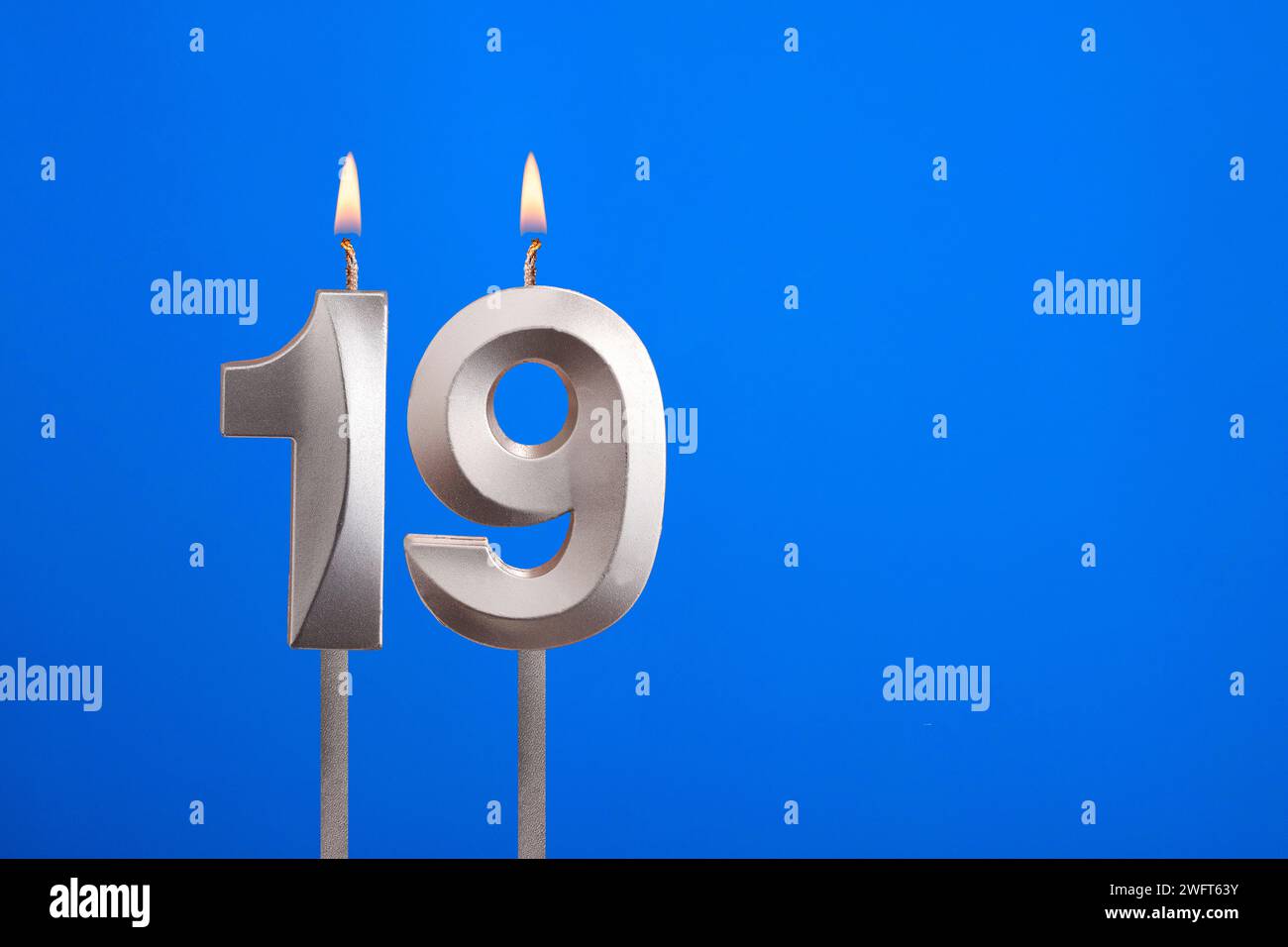 Birthday candle number 19 - Celebration card on blue background Stock ...