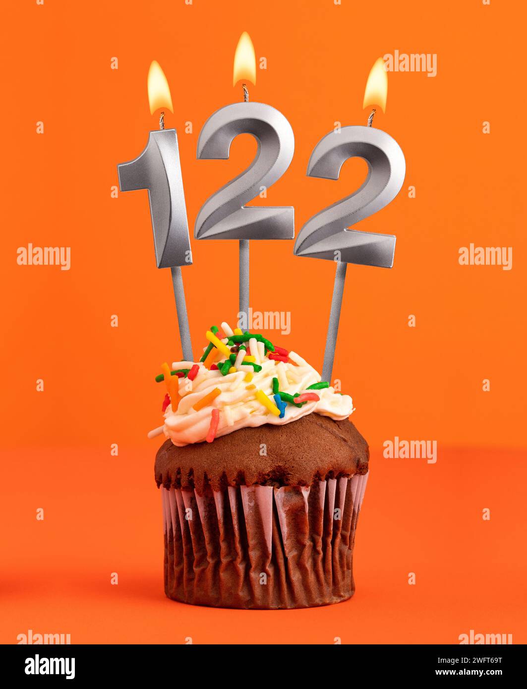 Birthday cupcake with number 122 candle - Orange color background Stock ...