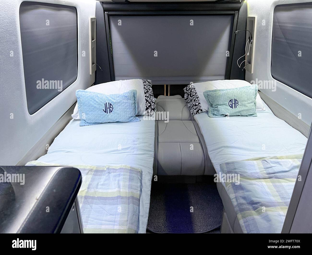 The beds made up to sleep in the back of a camper van Recreational ...