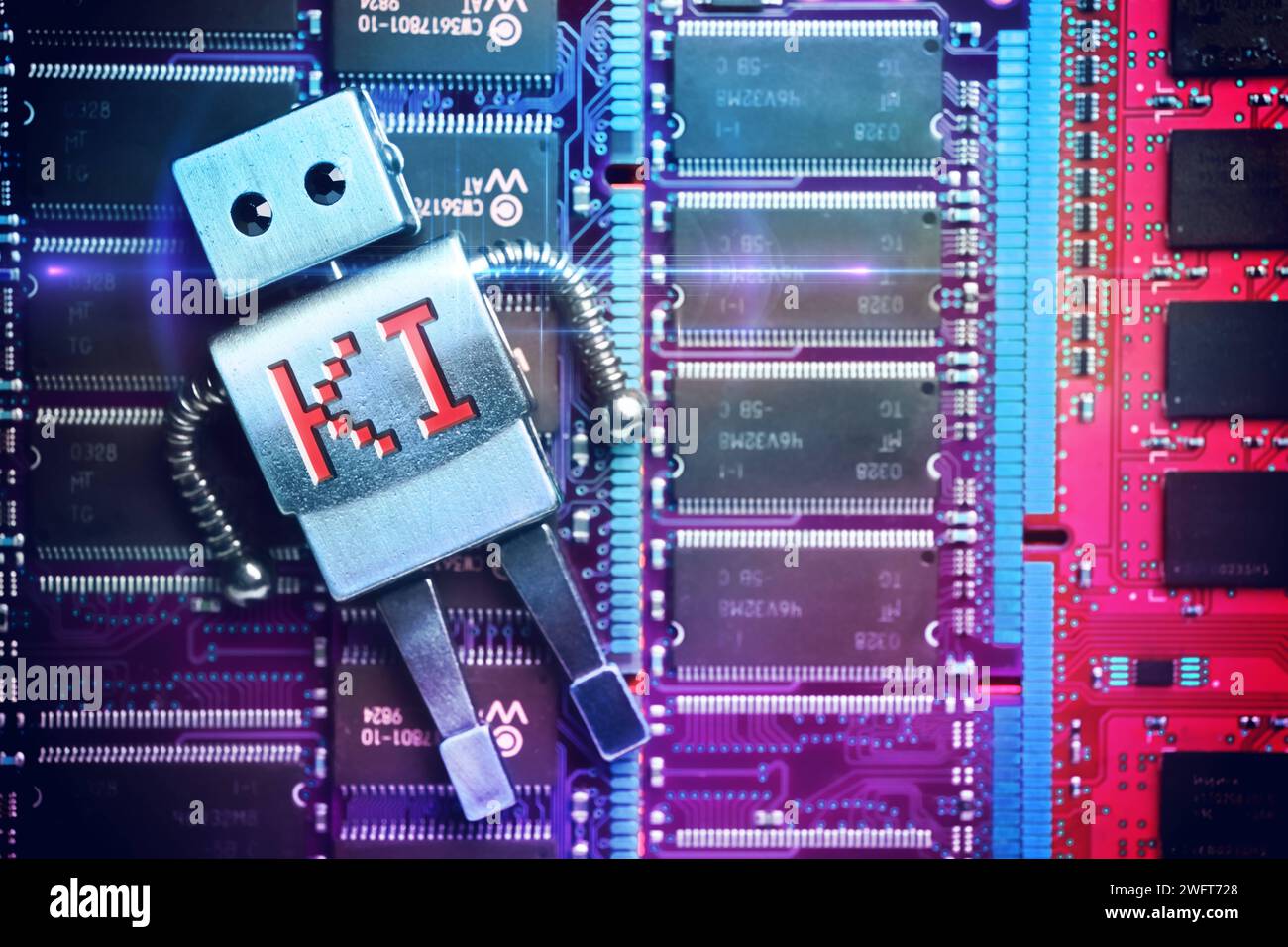 FOTOMONTAGE, Roboterfigur mit Aufschrift KI liegt auf Computerplatinen ...