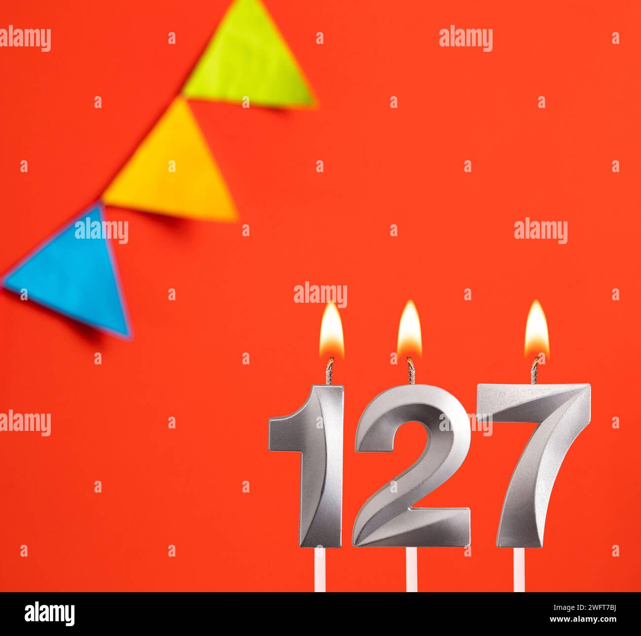 Birthday candle number 127 - Invitation card in orange background Stock ...