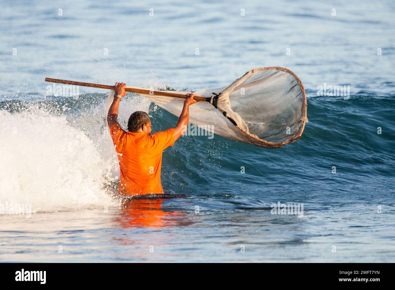 French Polynesia, Tahiti, surfing site at Teahupo'o: fisherman with a ...