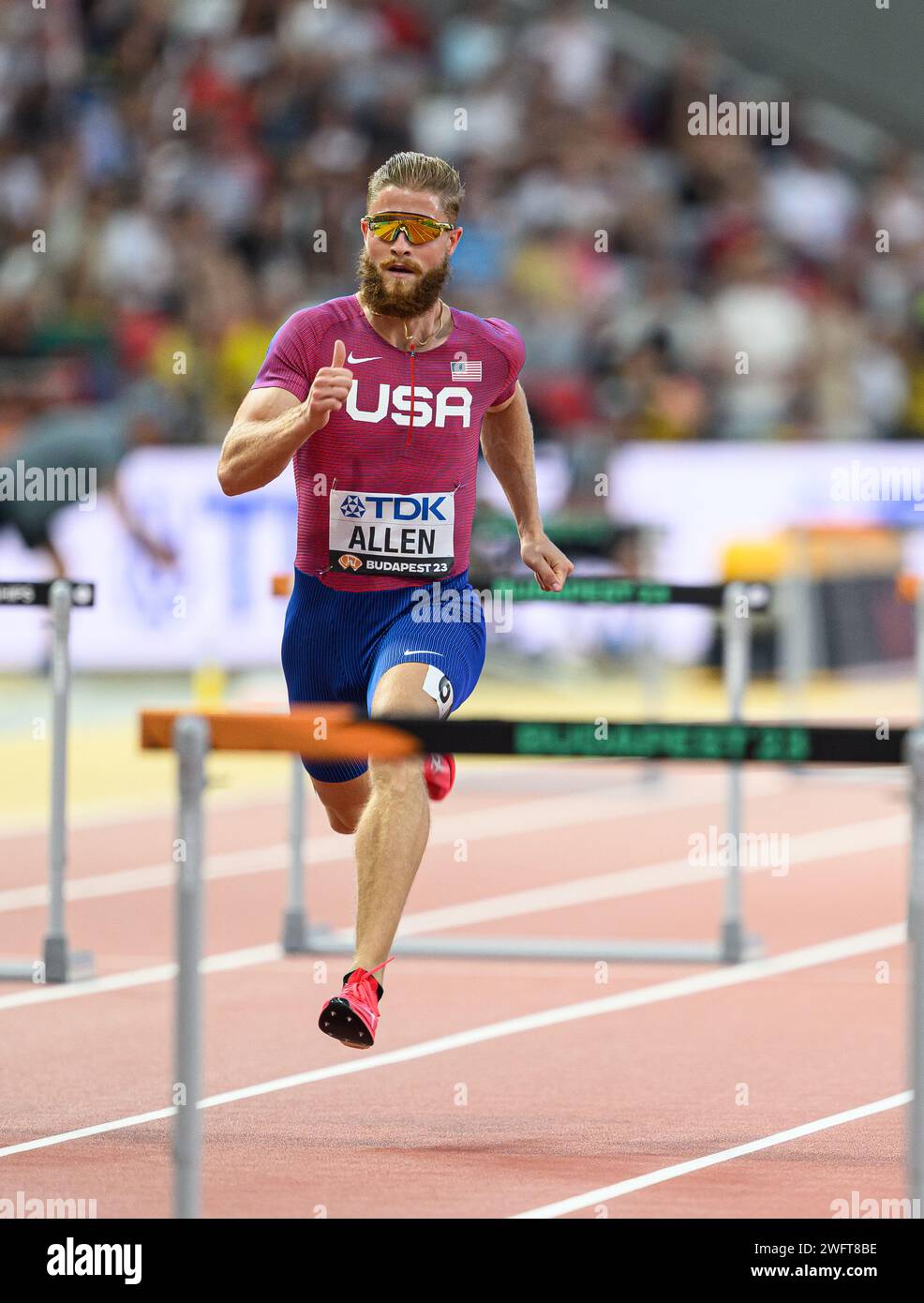 CJ ALLEN participating in the 400 meters hurdles at the World Athletics ...
