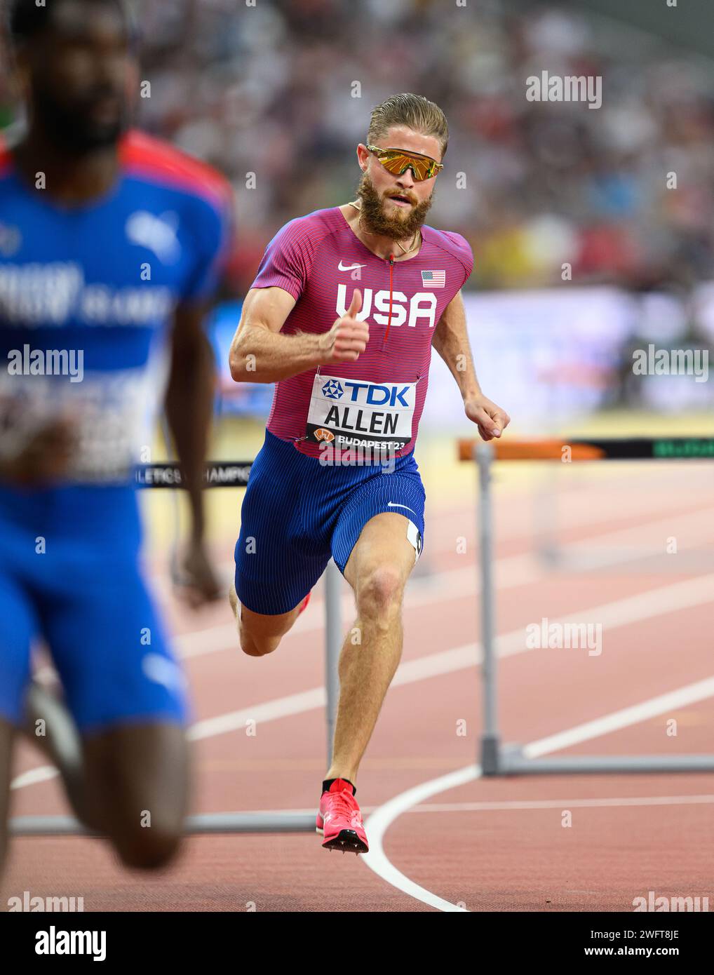 CJ ALLEN participating in the 400 meters hurdles at the World Athletics ...