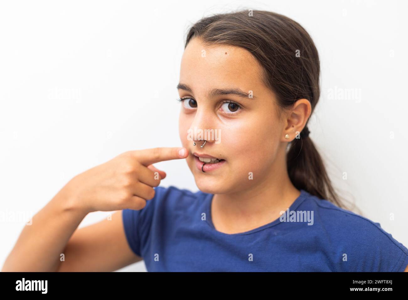 cool teen girl face with piercing style Stock Photo - Alamy