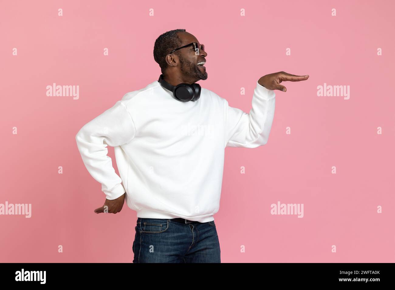 Funny black man wearing white sweatshirt dancing making Egyptian move ...
