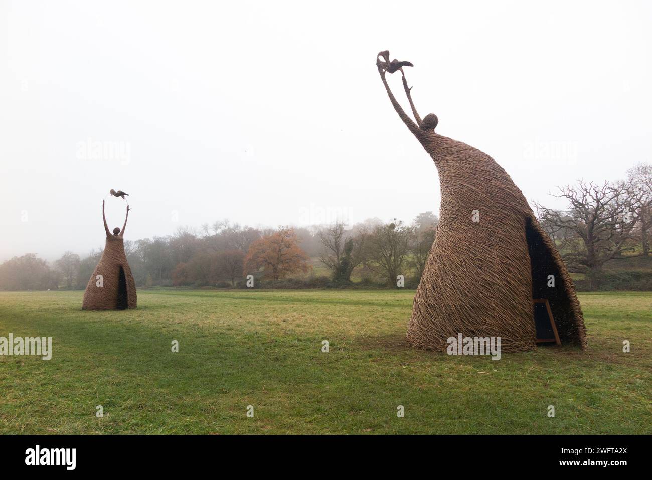 Sculpture of woman releasing bird (a peace dove perhaps), made from ...