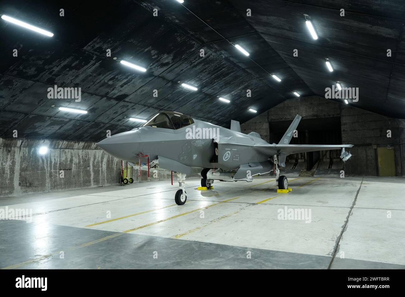 A Norwegian F-35 fighter plane in place in a hangar at Keflavik in ...