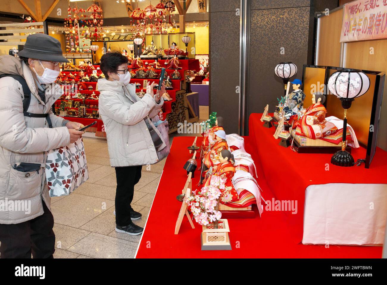 Tokyo, Japan. 01st Feb, 2024. Visitors take photos of unique Hina dolls ...