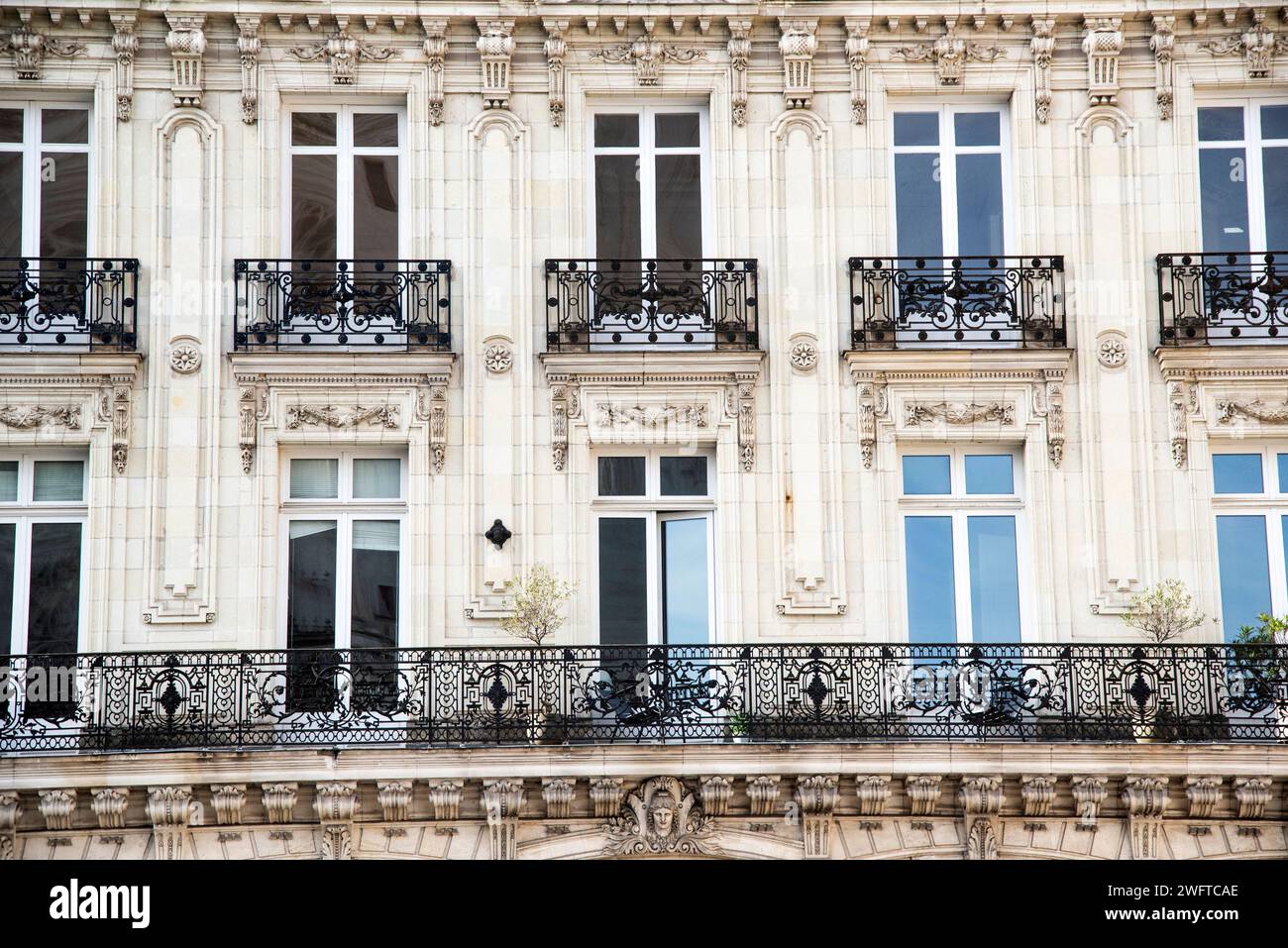 Facade of a beautiful old tenement house in France, historic French ...
