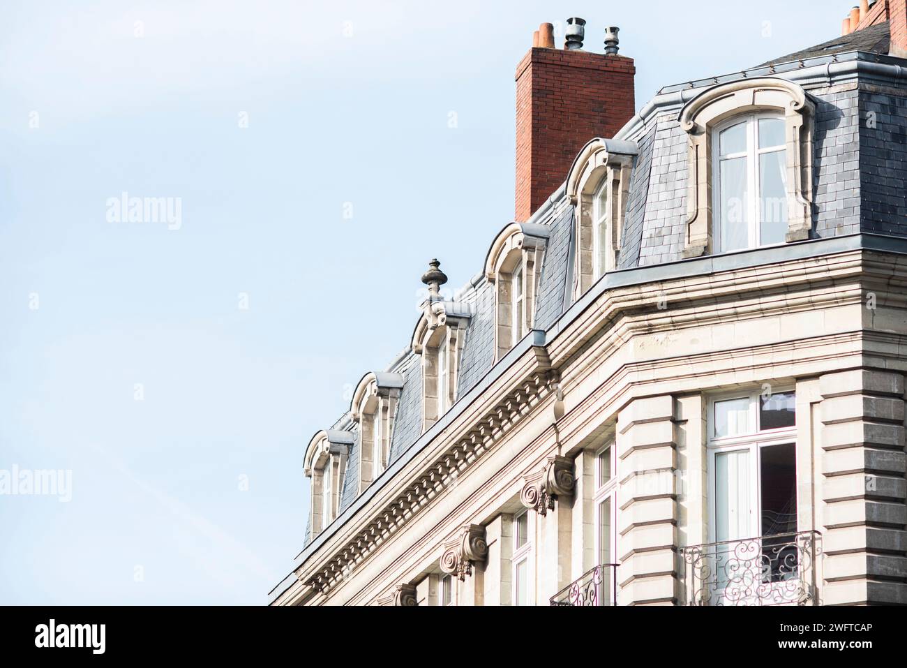 Facade of a beautiful old tenement house in France, historic French ...