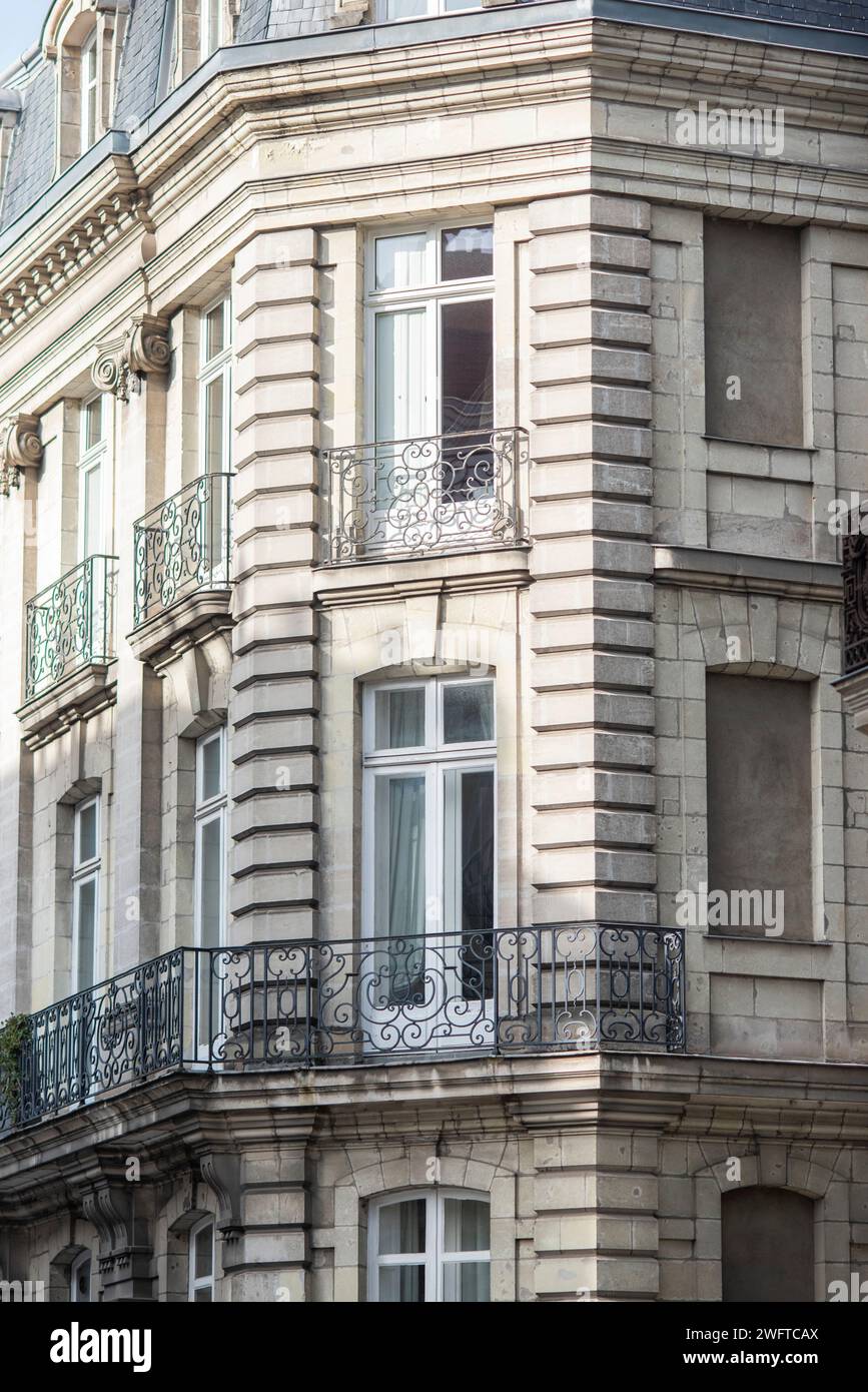 Facade of a beautiful old tenement house in France, historic French ...