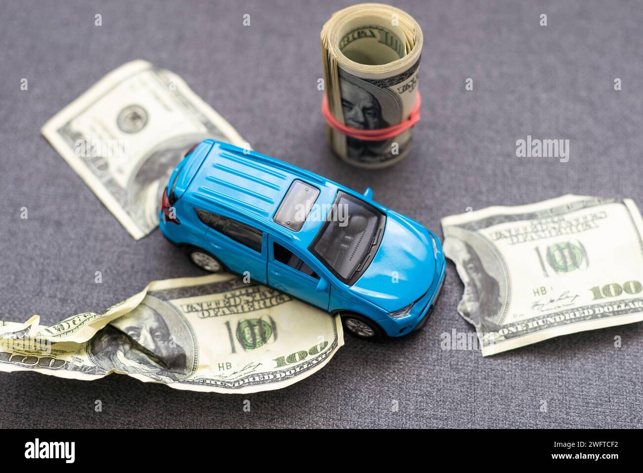 blue car model on dollar bills Stock Photo - Alamy