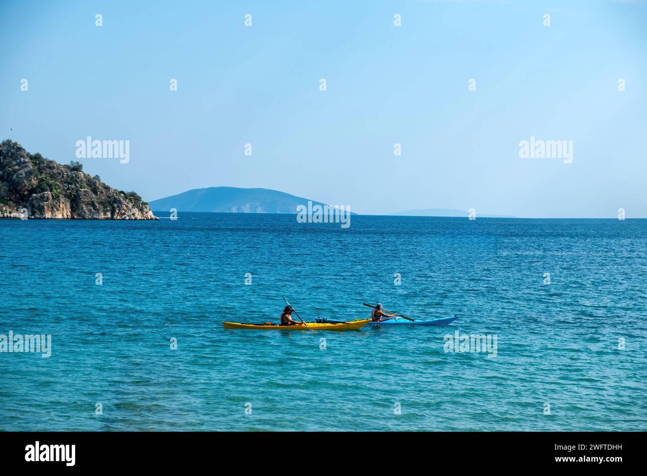 Two canoe kayak with oar in vast blue calm sea. Relaxation with rowing ...