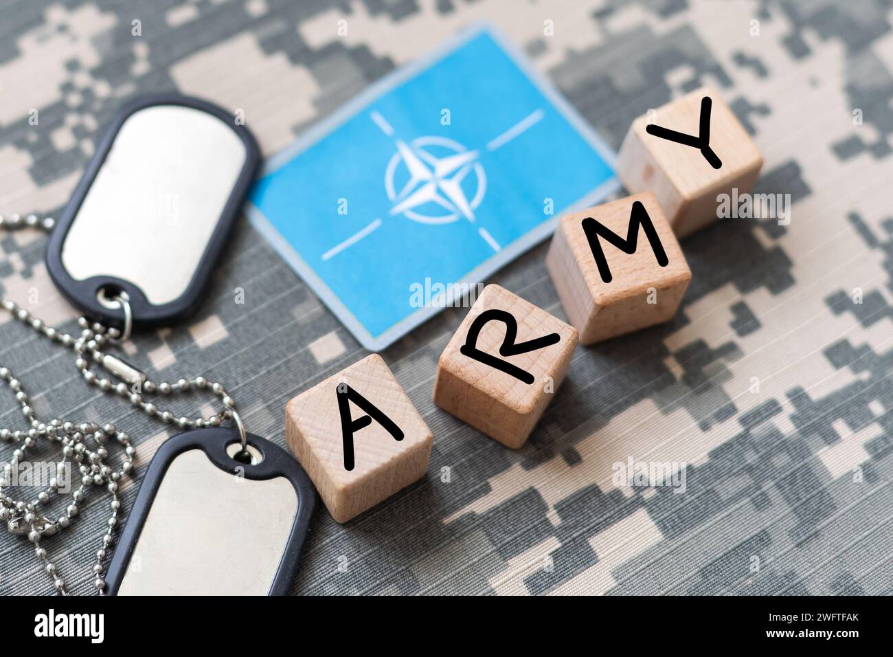 Military ID tags and US army patches on camouflage background Stock ...