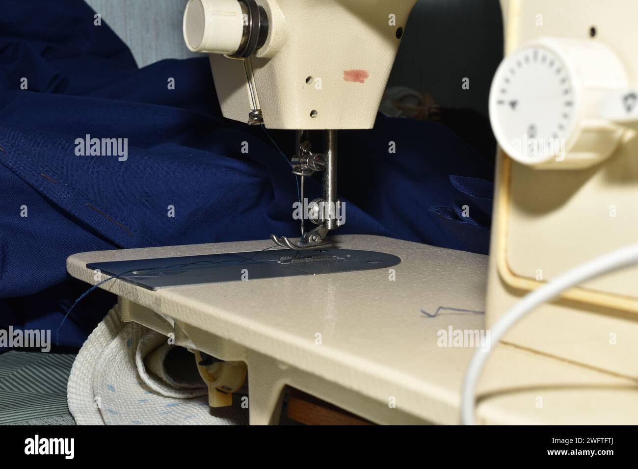 The picture shows a sewing machine ready for use. The object table ...