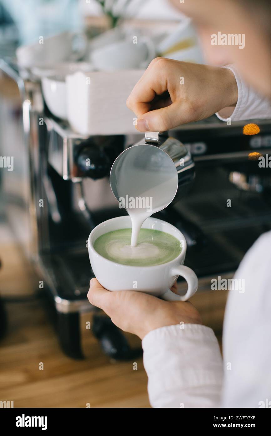 Barista prepares tasty and healthy matcha latte tea Stock Photo - Alamy
