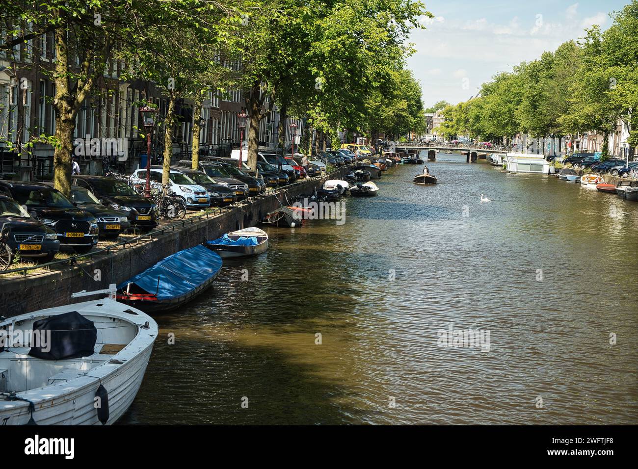 Amsterdam,Netherlands- July 8,2022: Amsterdam canal with cruise boats ...