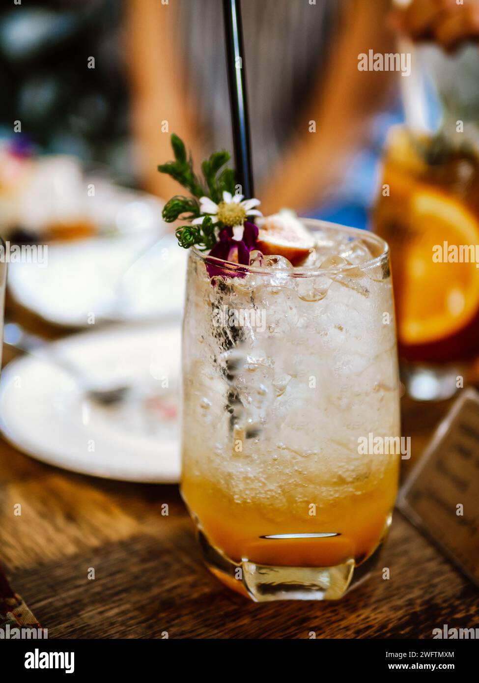 Glass of Iced fruit soda with lemon and passion fruit half slice on a ...