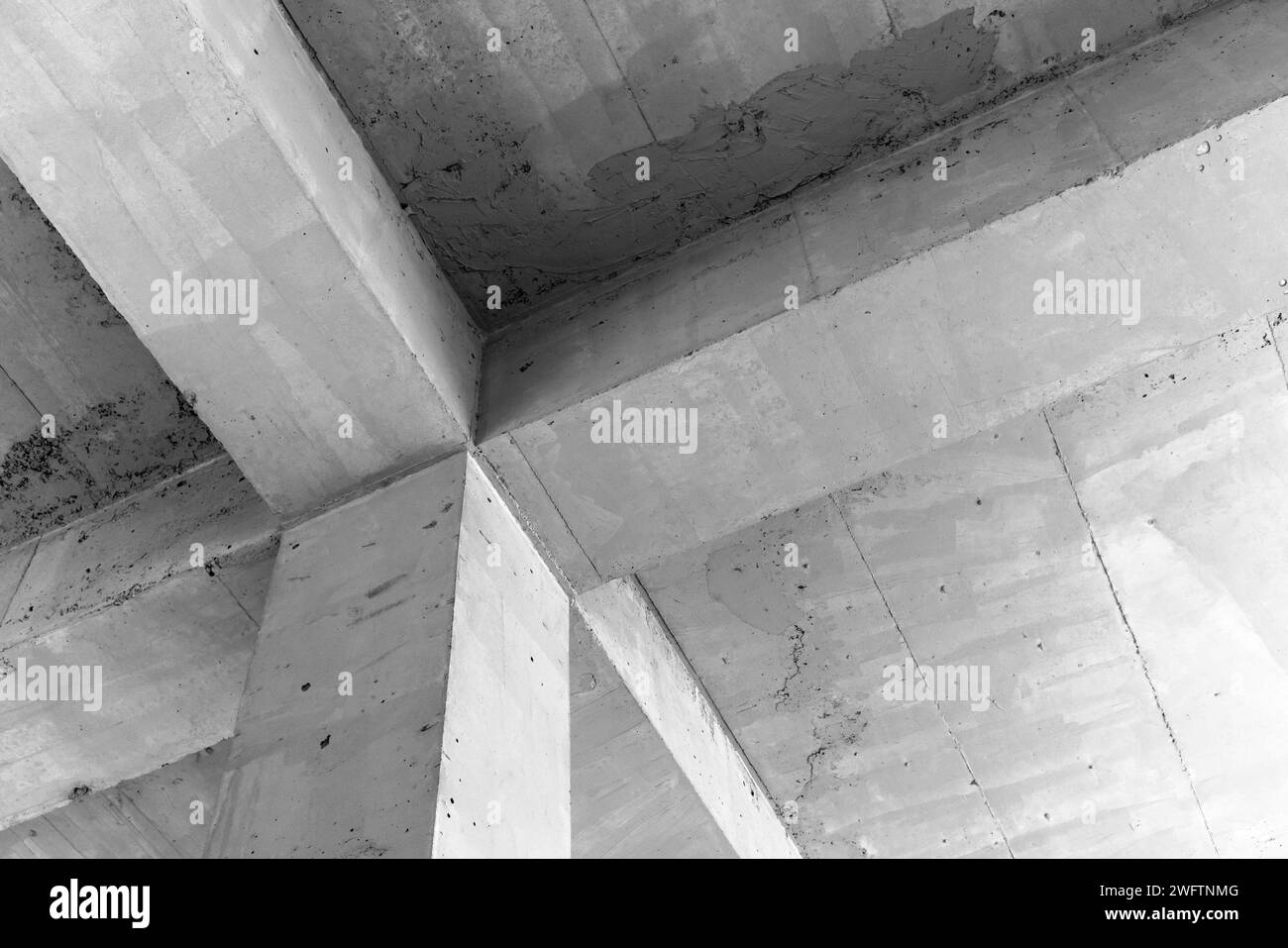 Abstract concrete construction background, ceiling with girders and ...